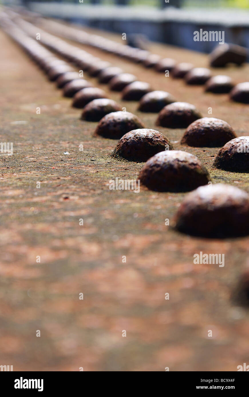 Closeup of a rusted iron bridge support girder with studs Stock Photo ...