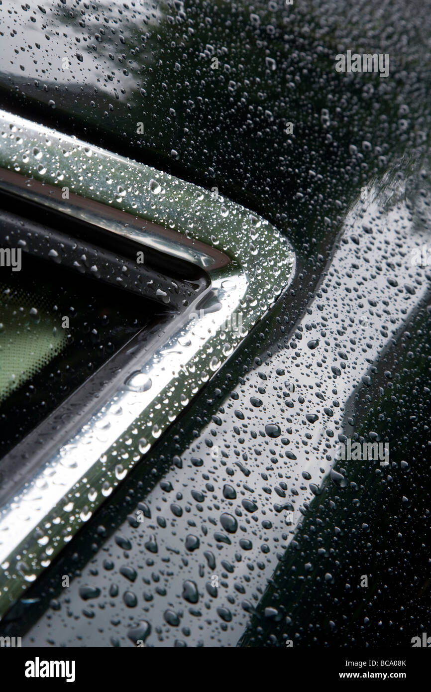 Detail of car in rain with raindrops Stock Photo - Alamy