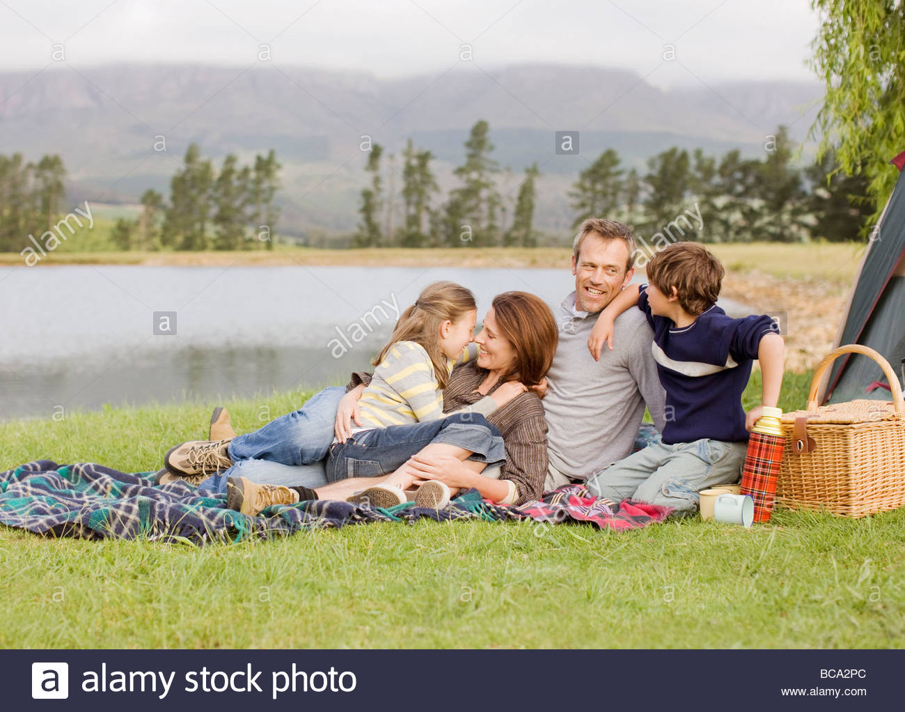 Smiling Woman Camping Family Stock Photos & Smiling Woman Camping ...