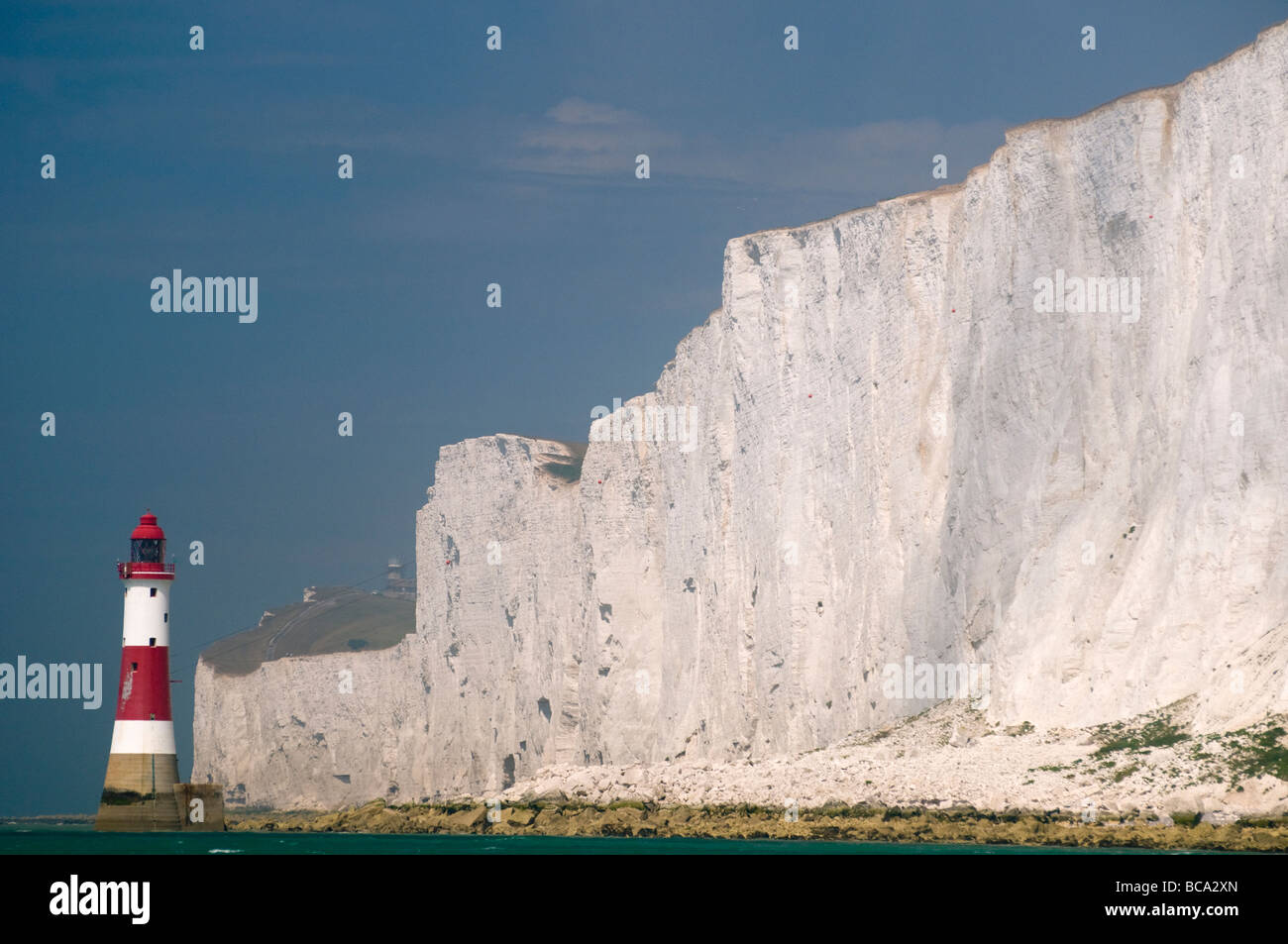 A view of the lighthouse and cliffs at Beachy Head, Sussex, England ...