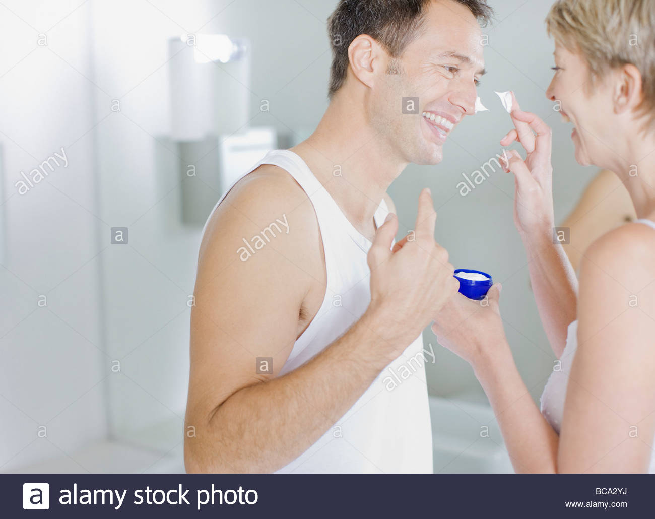 Putting On Lotion Stock Photos & Putting On Lotion Stock Images - Alamy
