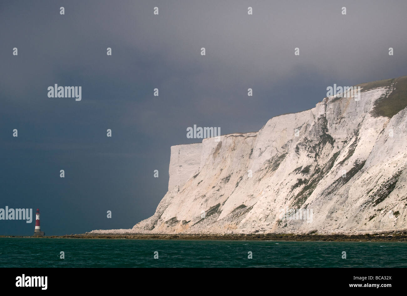A view of the cliffs and lighthouse at Beachy Head, Sussex, England ...
