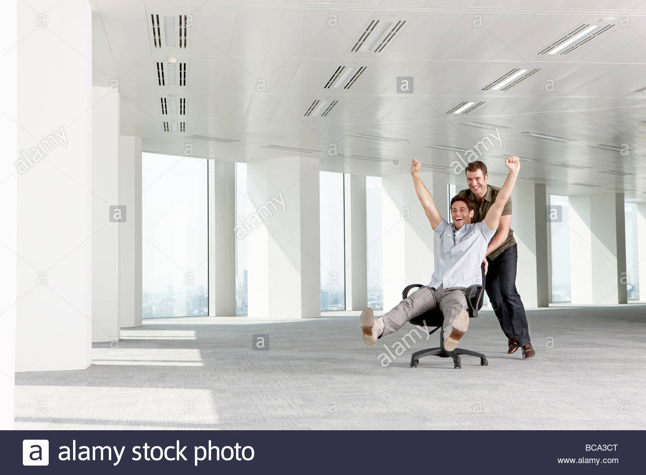 Office Chair Pushing Stock Photos & Office Chair Pushing Stock Images ...