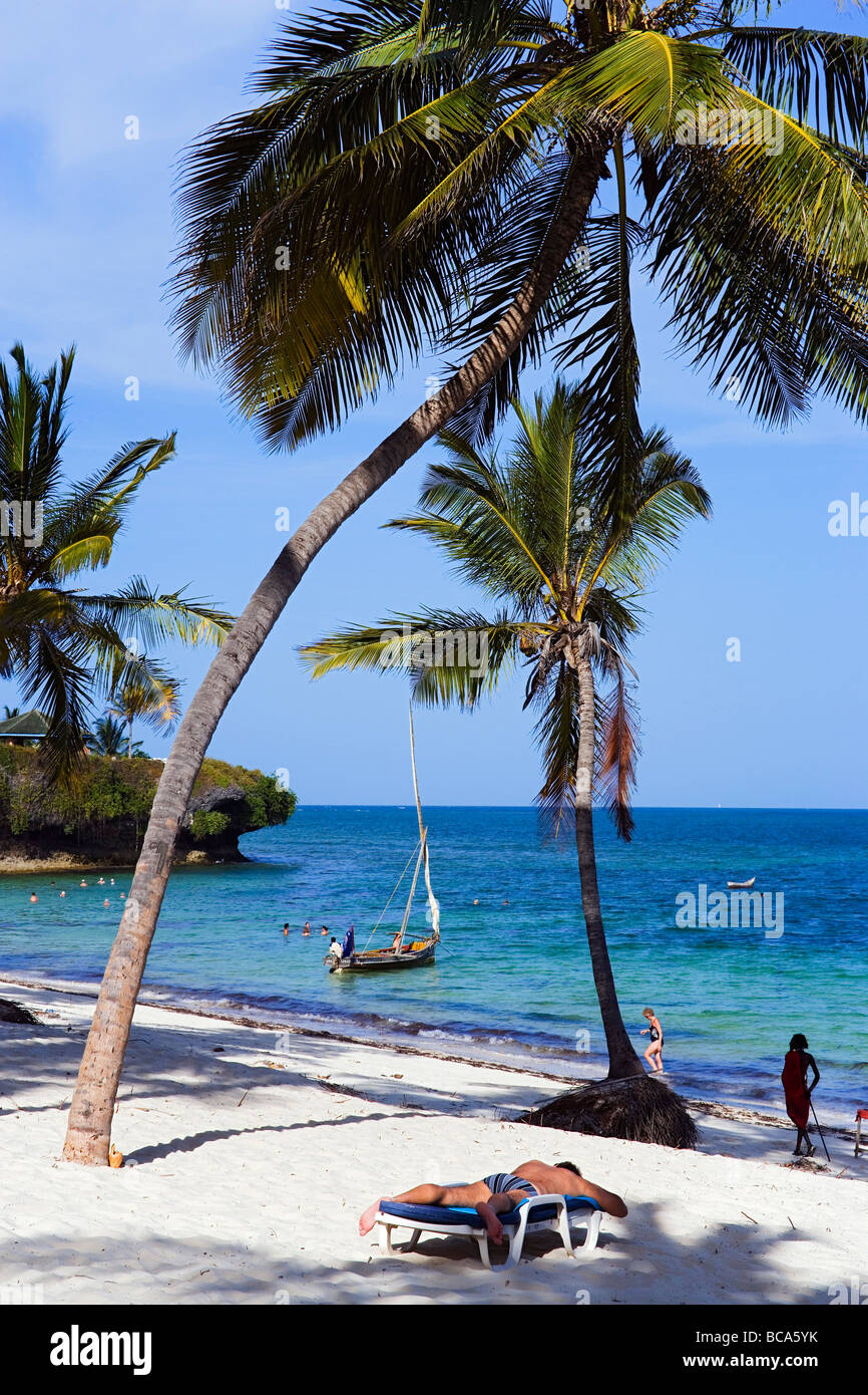Tourists relaxing at Shanzu Beach, Coast, Kenya Stock Photo - Alamy