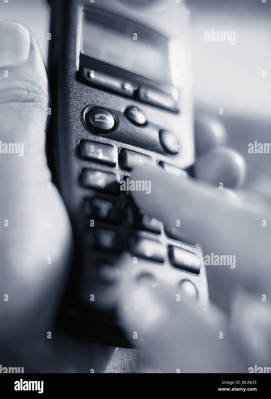 Hand typing number on wireless phone Stock Photo - Alamy
