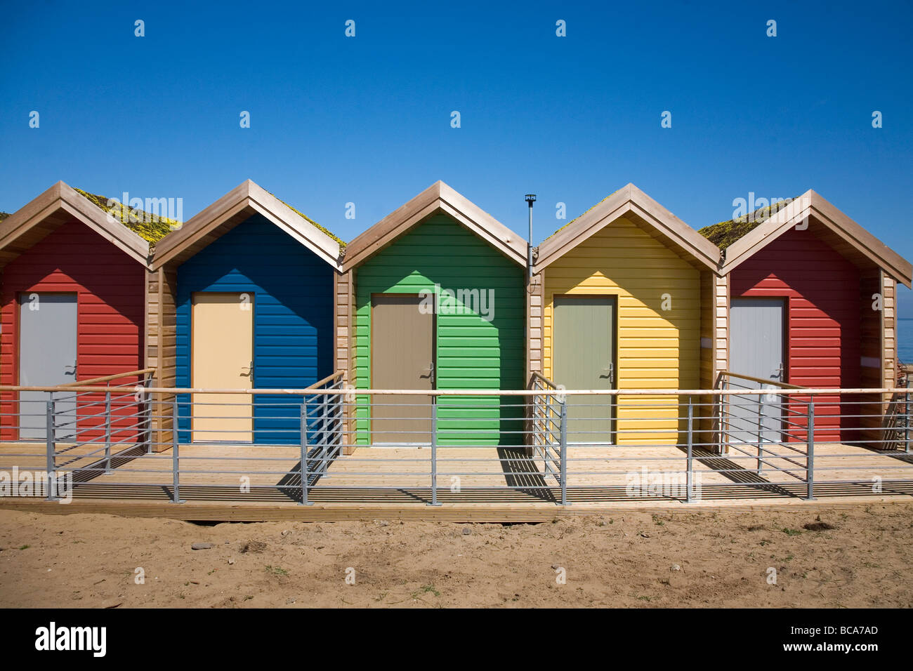 Modern beach huts at Blyth in northern England. The huts can be hired ...