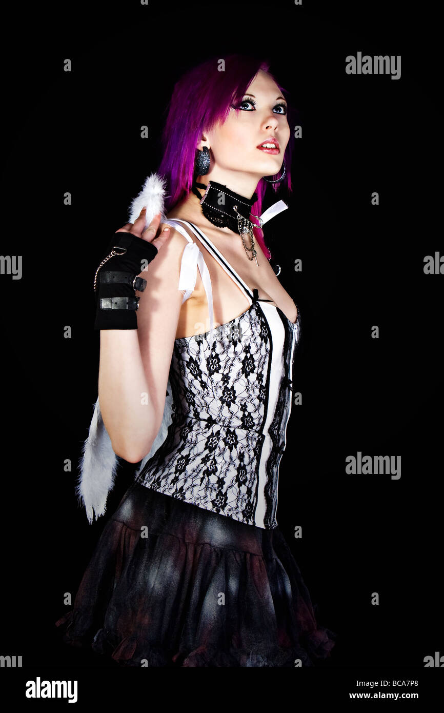 Shot of an Alternative Girl in Angel Wings Looking Up Stock Photo - Alamy