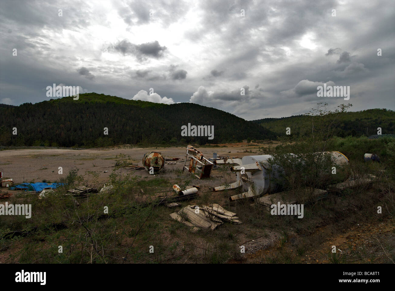 Abandoned iron waste in landscape Stock Photo - Alamy