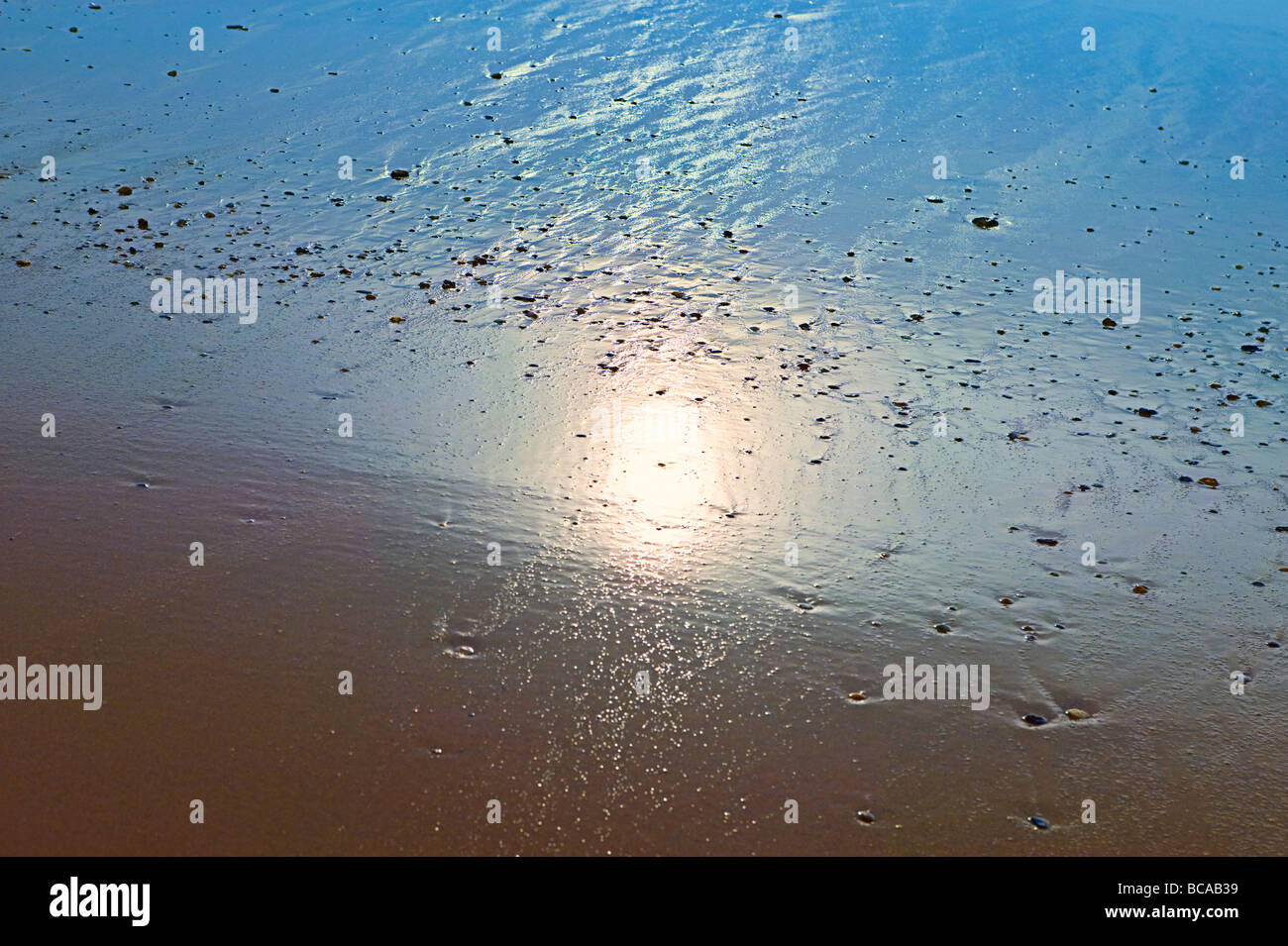 sunset reflection on wet sand Stock Photo - Alamy