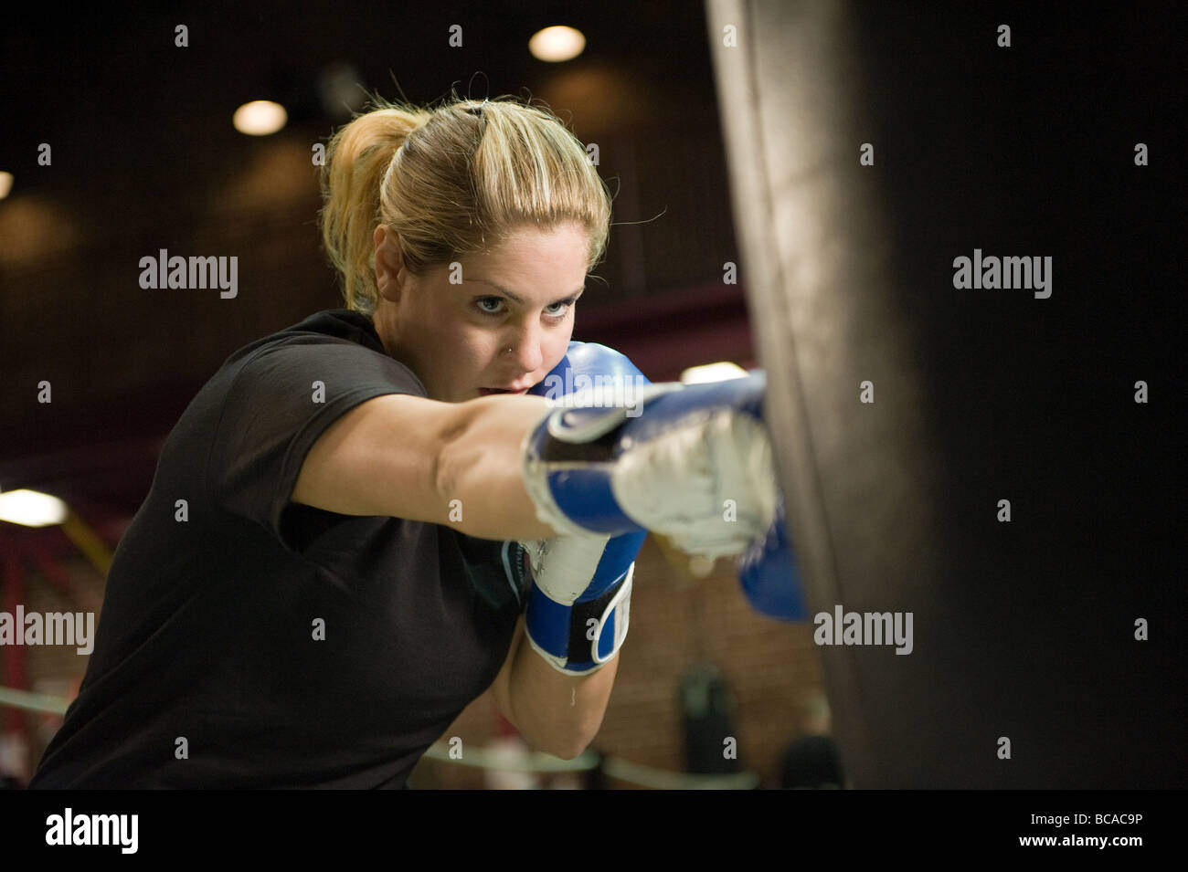 An action shot of a female boxer training Stock Photo - Alamy