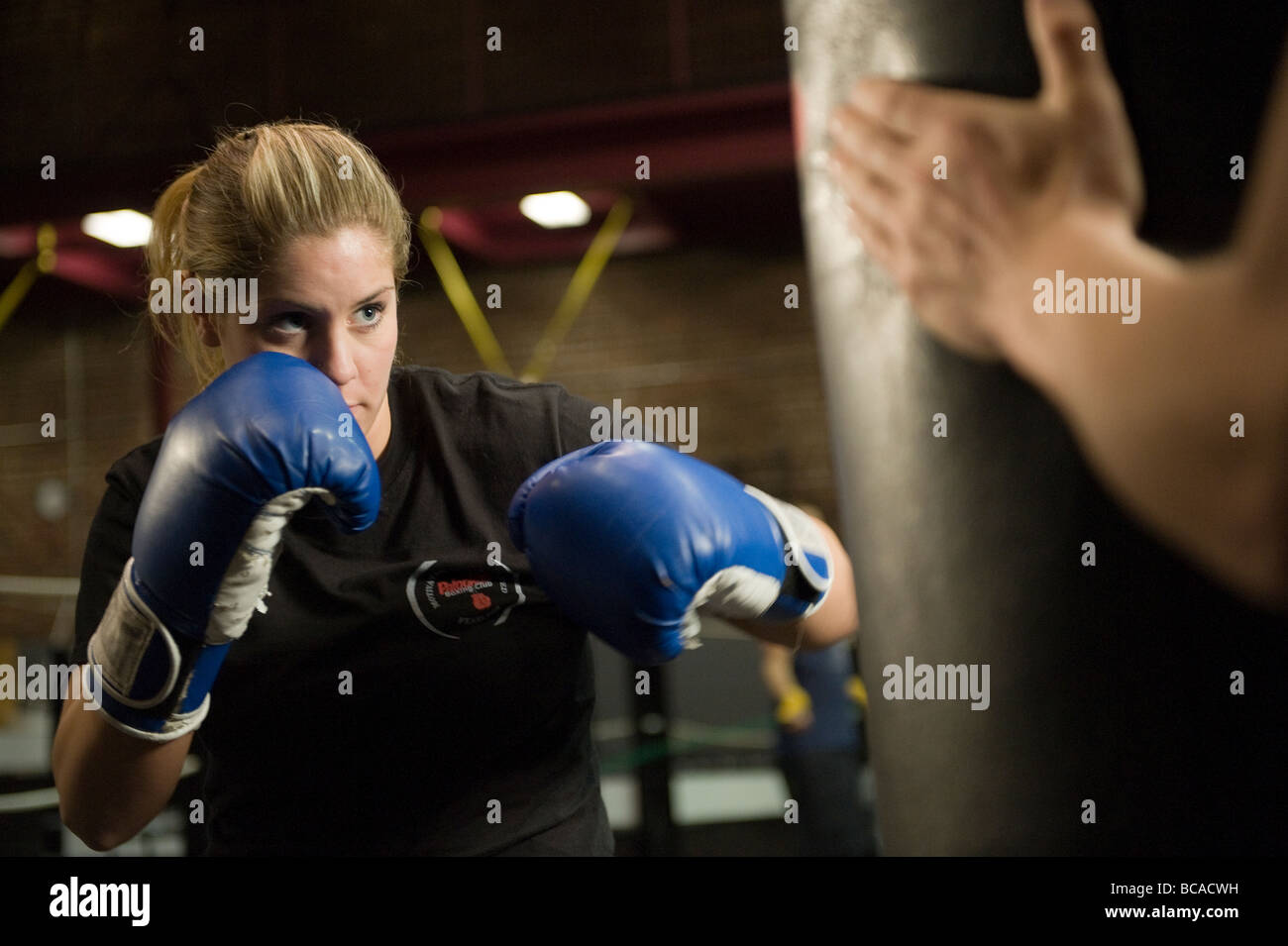 An action shot of a female boxer training Stock Photo - Alamy