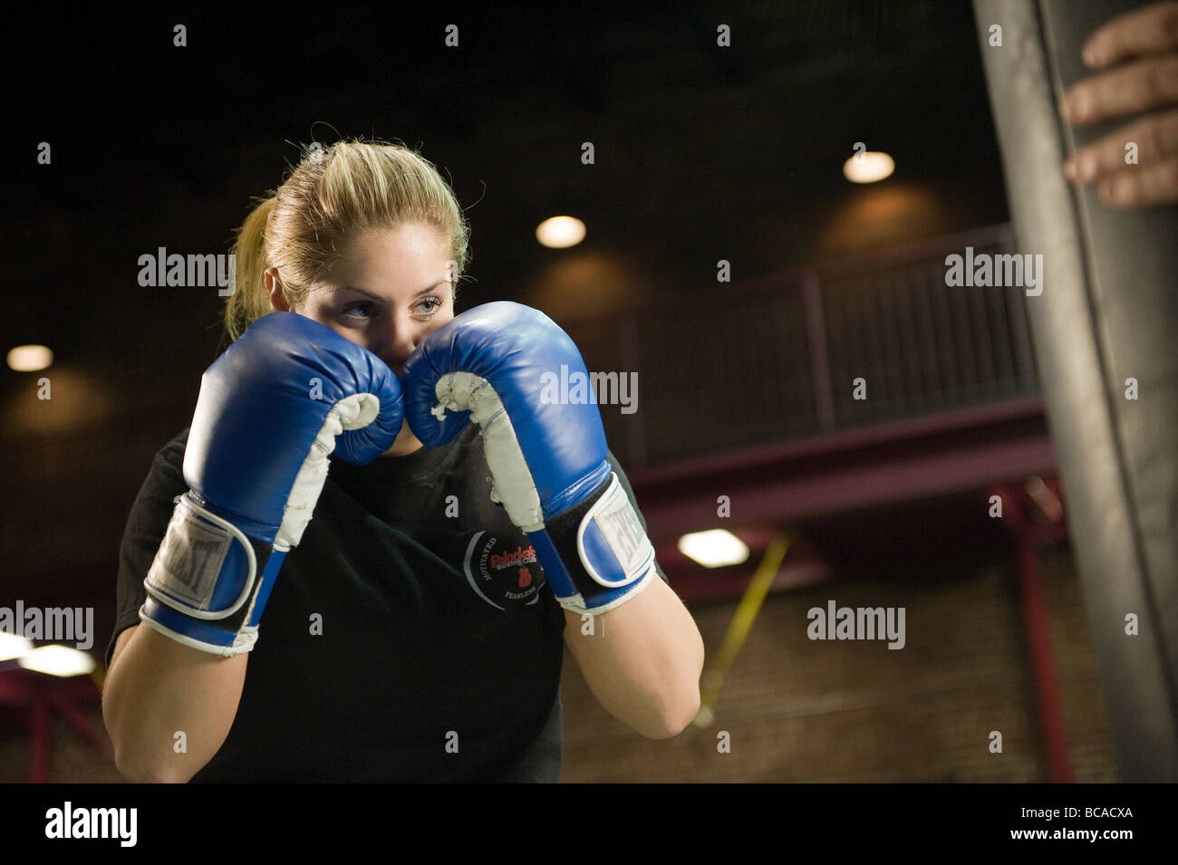 An action shot of a female boxer training Stock Photo - Alamy
