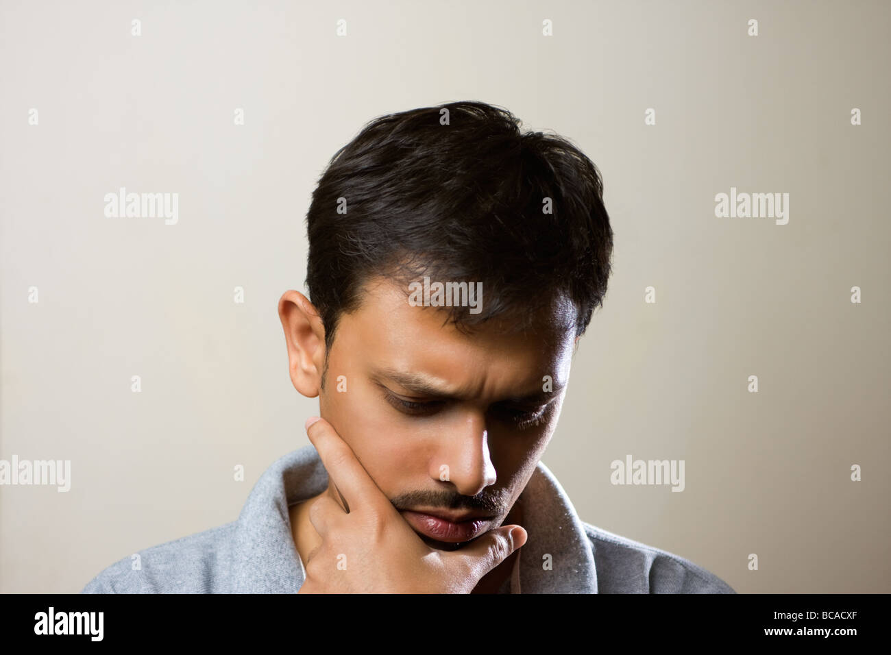 Male model thinking Stock Photo - Alamy
