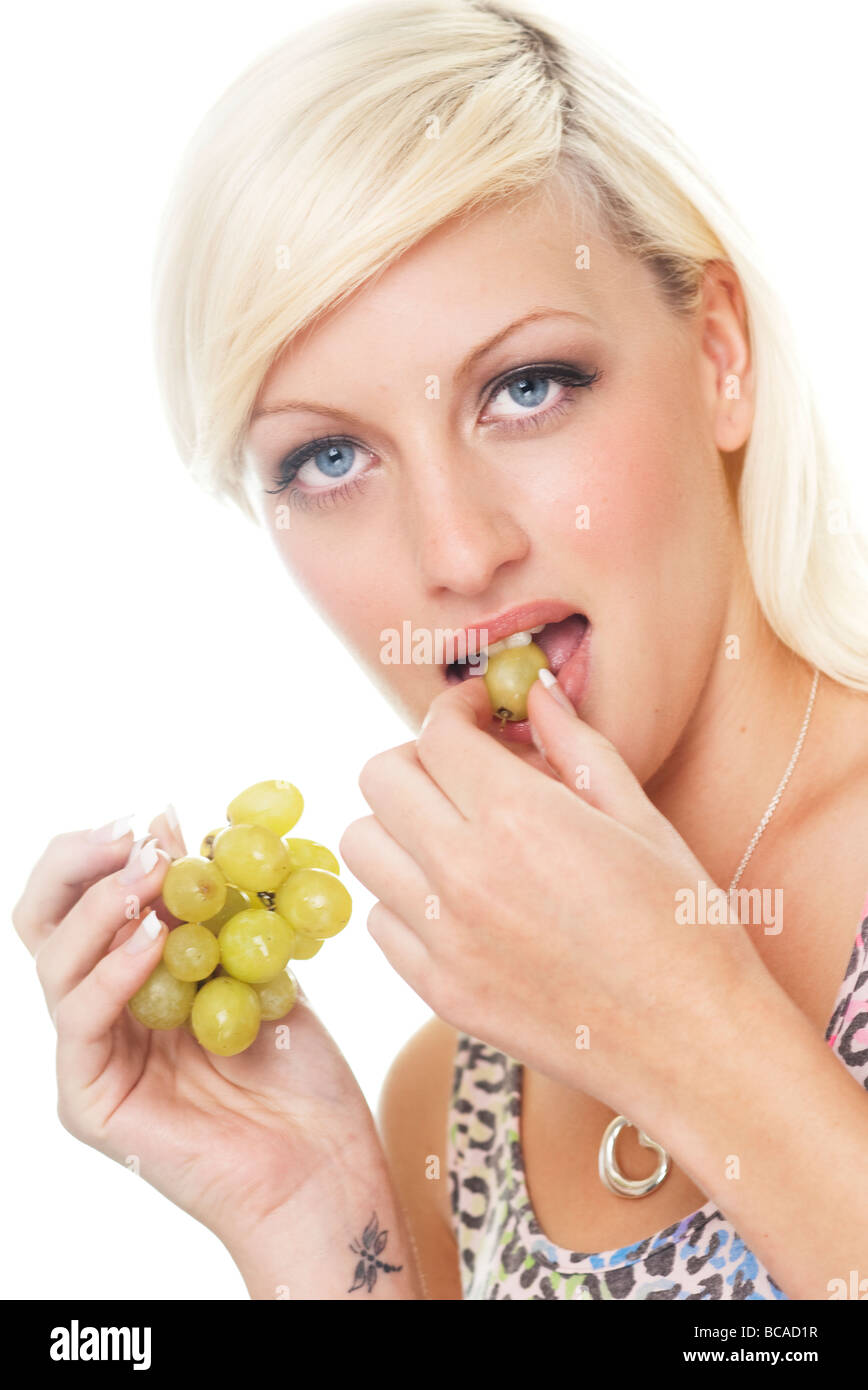 woman eating grapes Stock Photo - Alamy