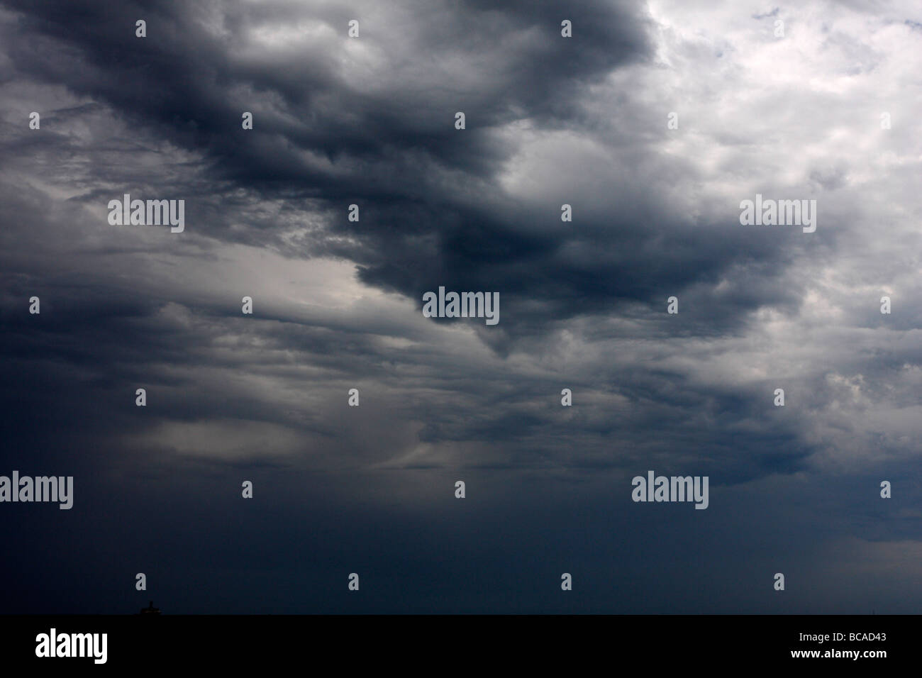 Turbulent sky, result of a strong "cap" of air above and a boiling ...