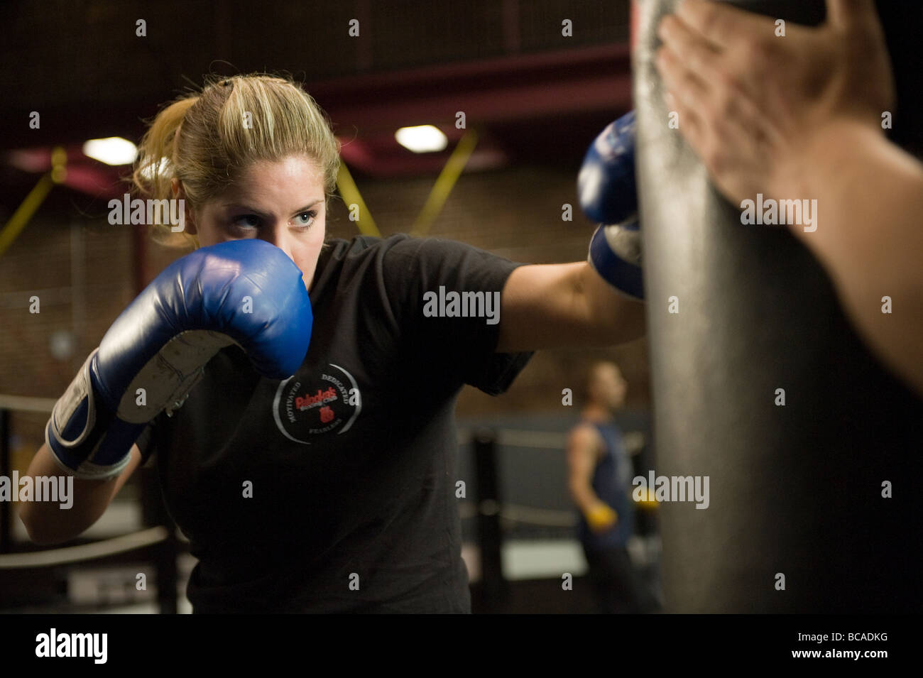 An action shot of a female boxer training Stock Photo - Alamy