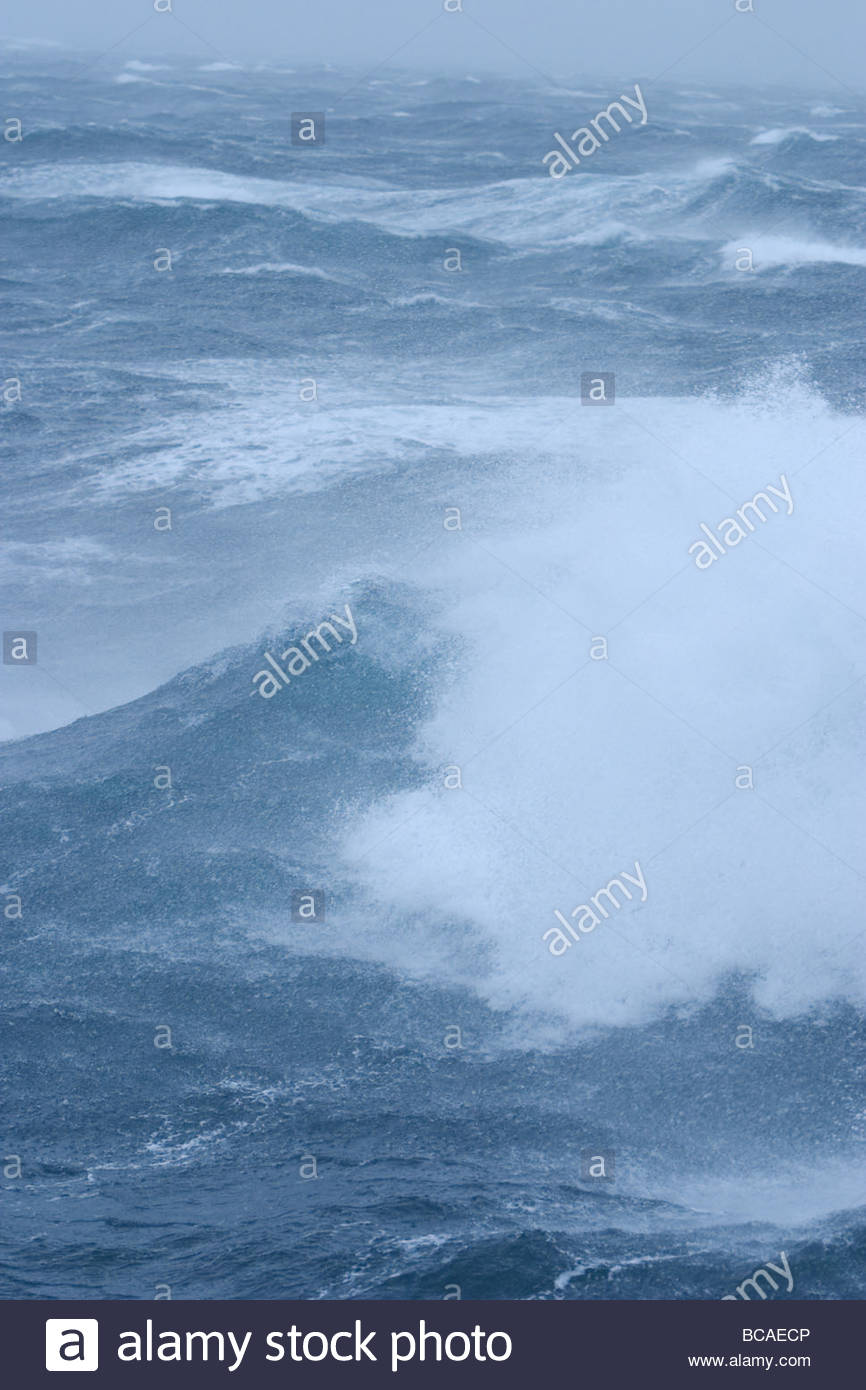 Spindrift blows off waves in gale force winds Stock Photo - Alamy