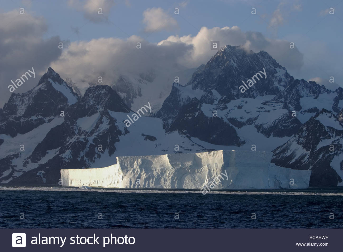 Giant tabular icebergs and snow-capped mountains Stock Photo - Alamy