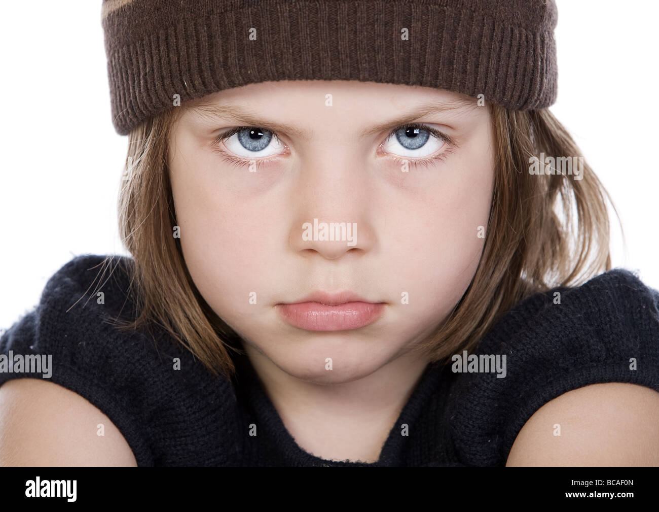 Shot of a Cute but Grumpy Child with Big Blue Eyes Stock Photo - Alamy