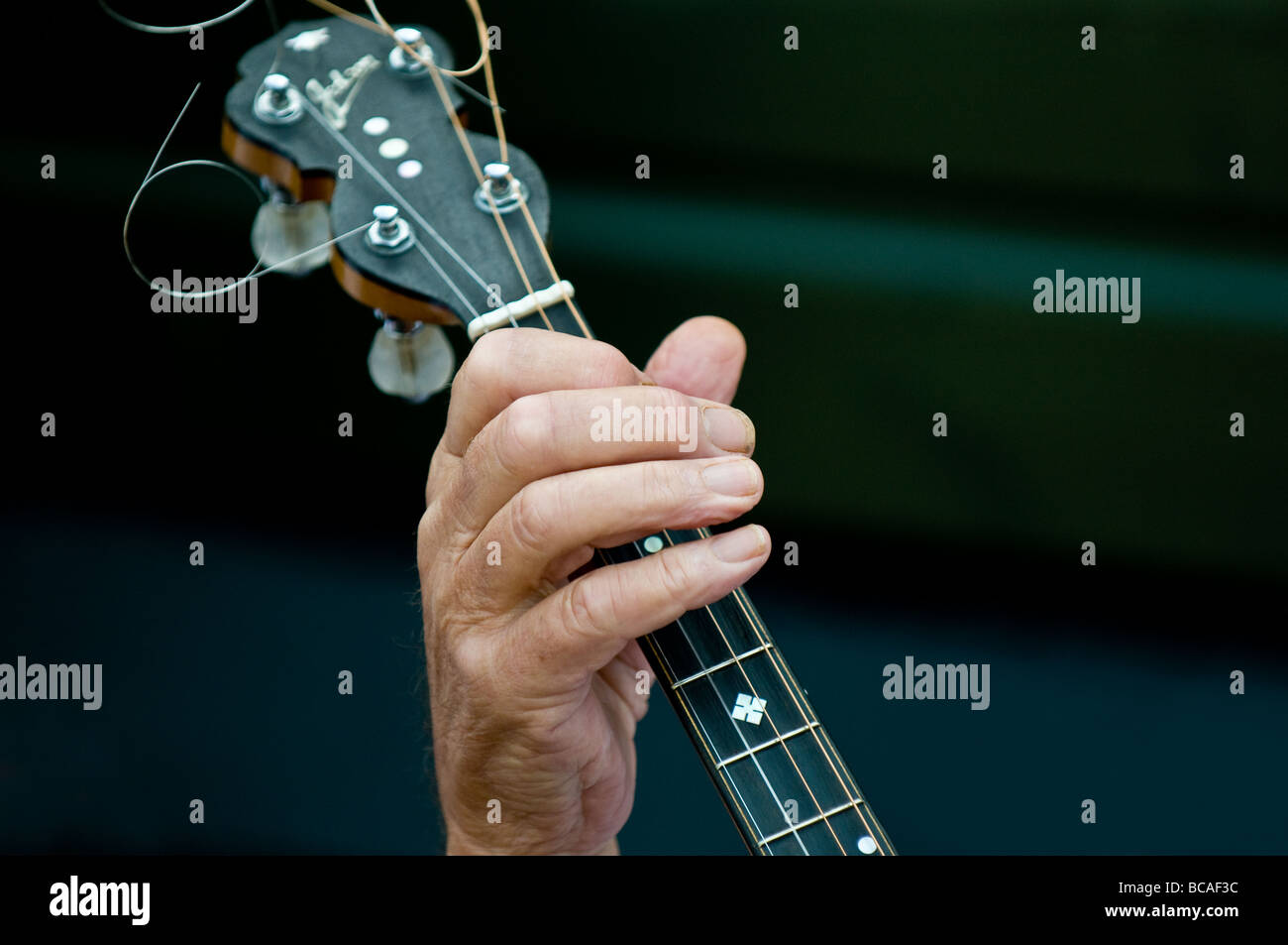 A musician holding a banjo. Photo by Gordon Scammell Stock Photo - Alamy