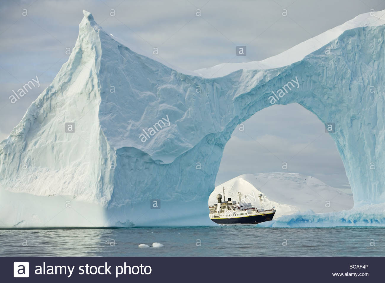Iceberg with arch frame, National Geographic Endeavour, Antarctica ...