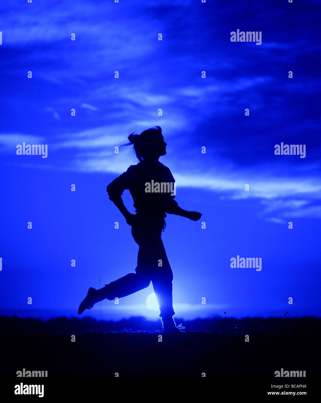 girl running at night Stock Photo - Alamy