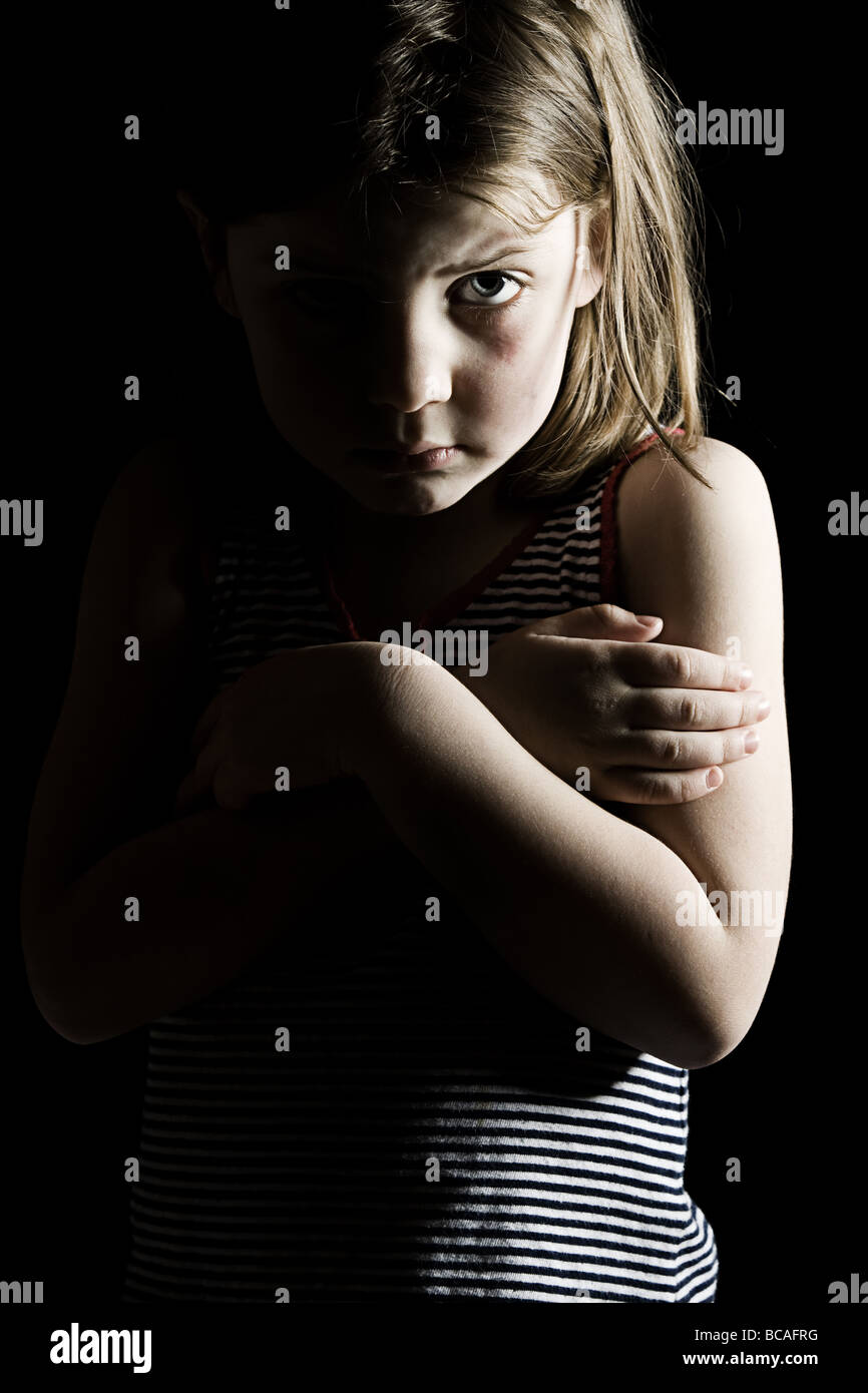Low Key Shot of a Frightened Looking Child Stock Photo - Alamy