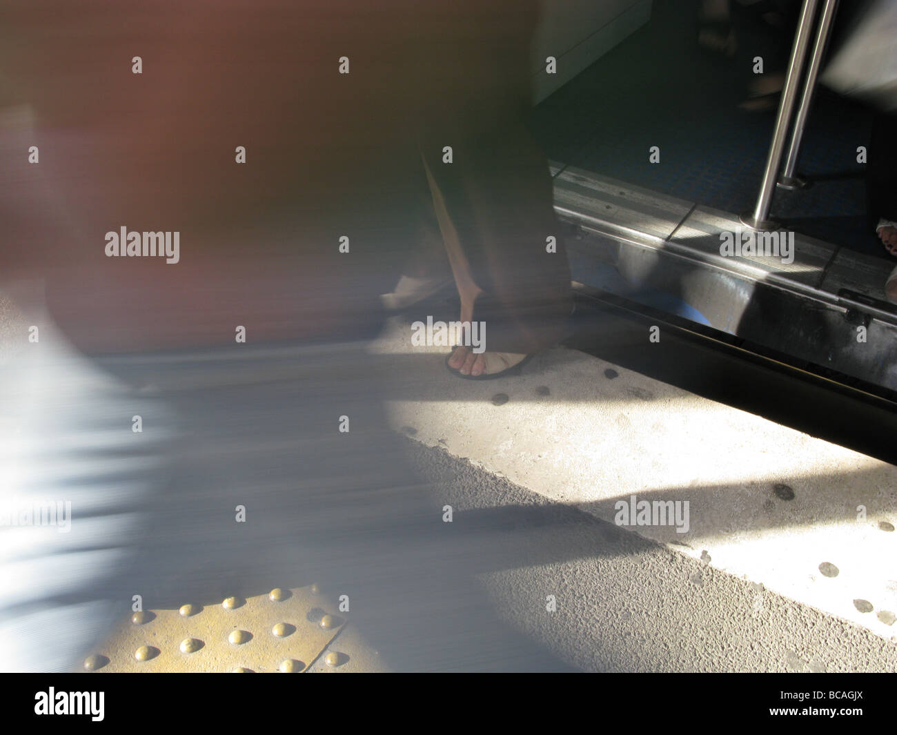 passengers getting off train at station platform Stock Photo - Alamy