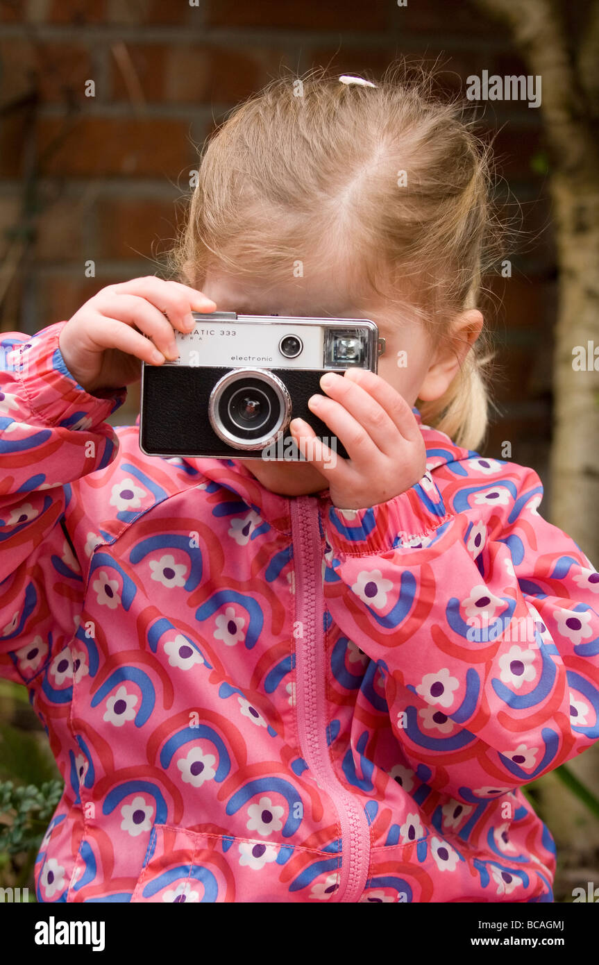 Small child with a camera Stock Photo - Alamy