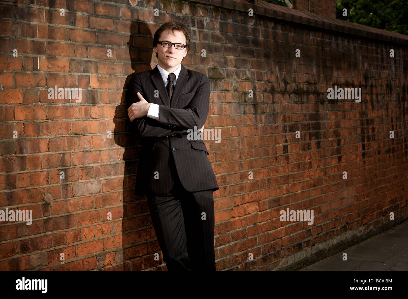 Silhouette on brick wall man hi-res stock photography and images - Alamy