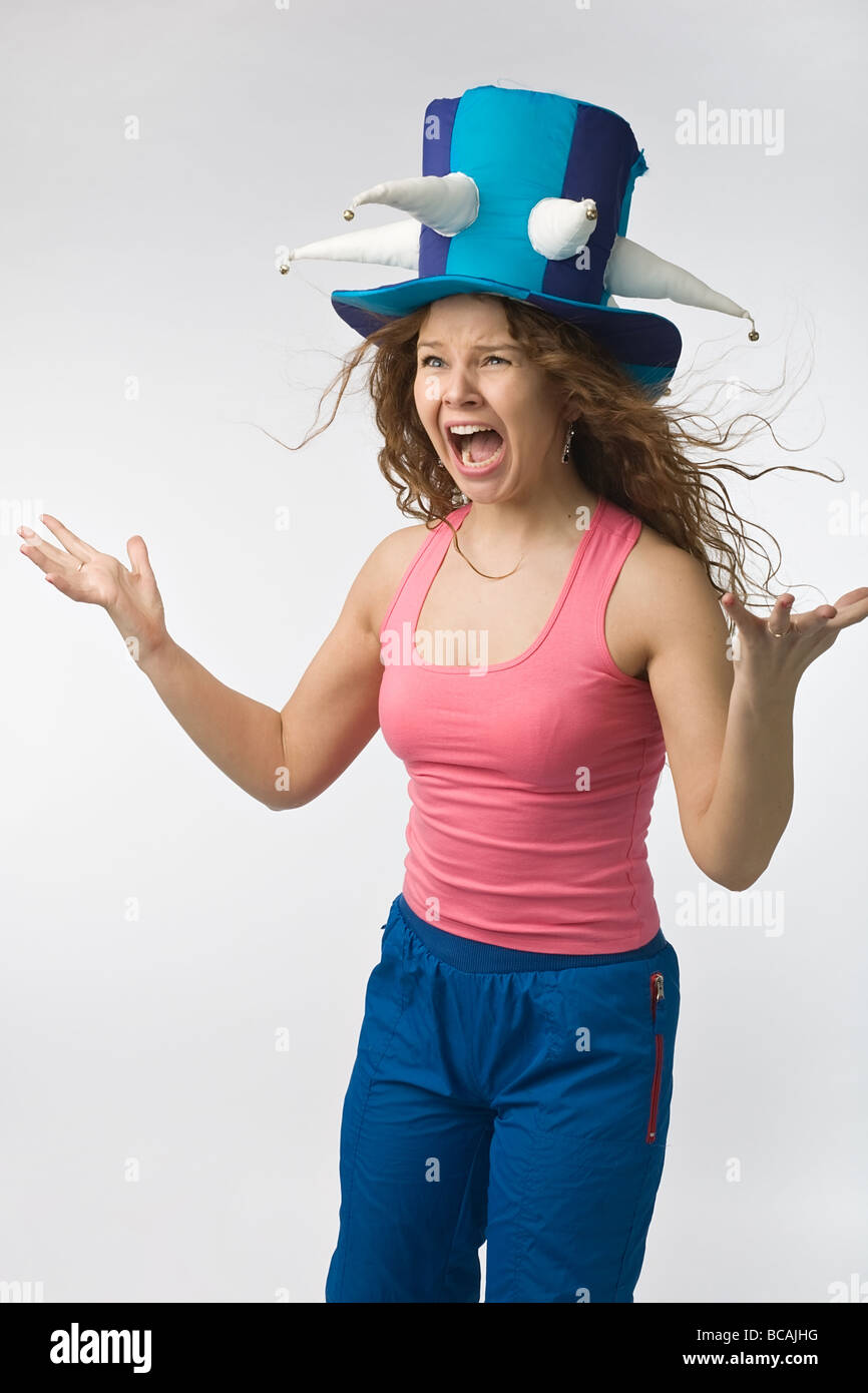emotionall girl in big football fan hat on gray background Stock Photo ...