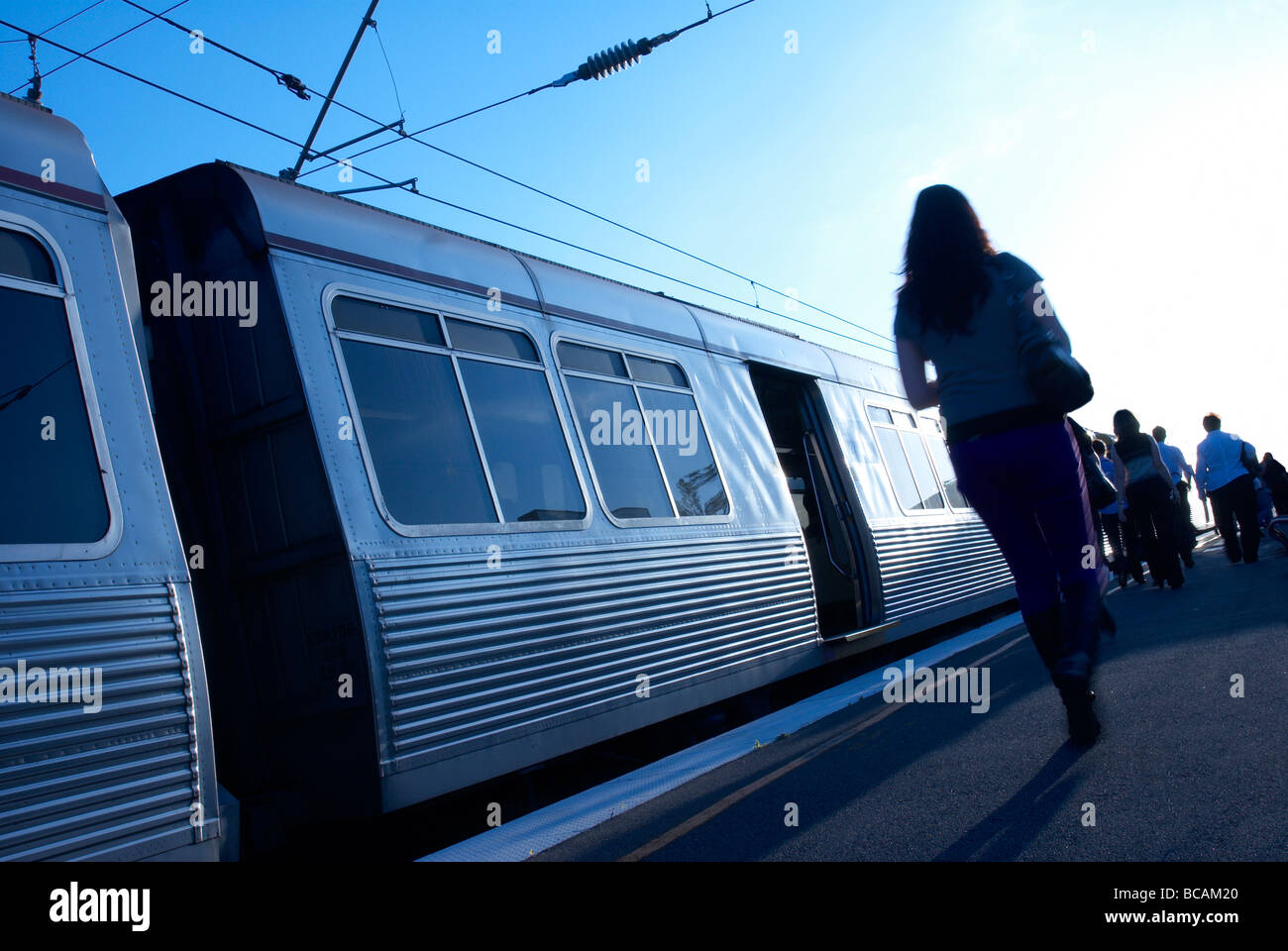 Commuters boarding city train Stock Photo - Alamy