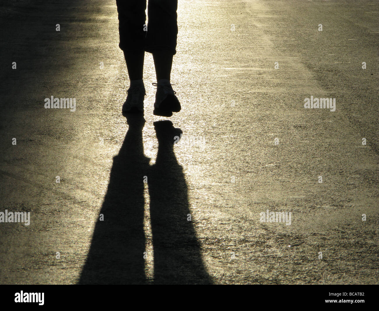 one person walking in empty street road in city town Stock Photo - Alamy