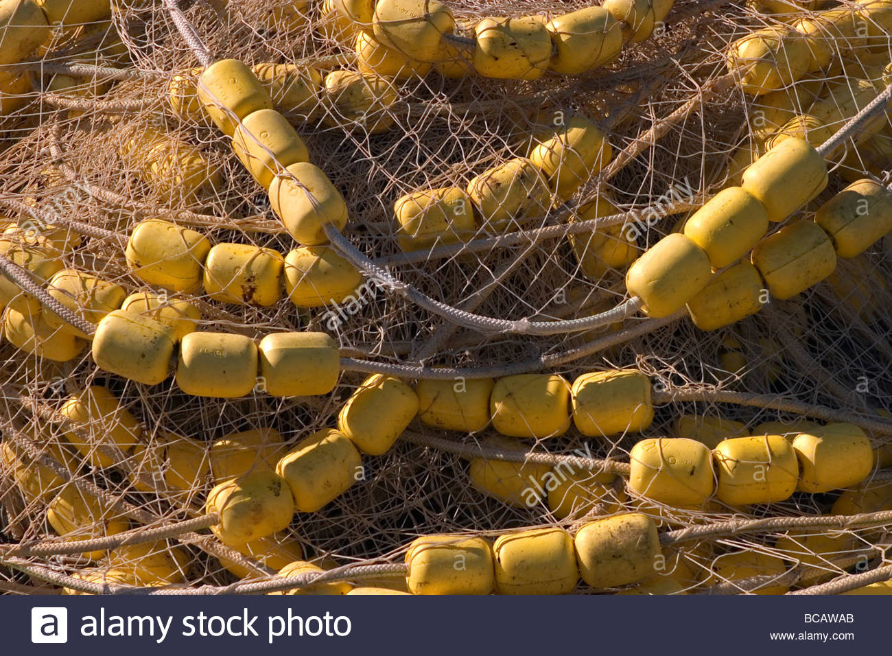 Fishing net with yellow floats Stock Photo - Alamy