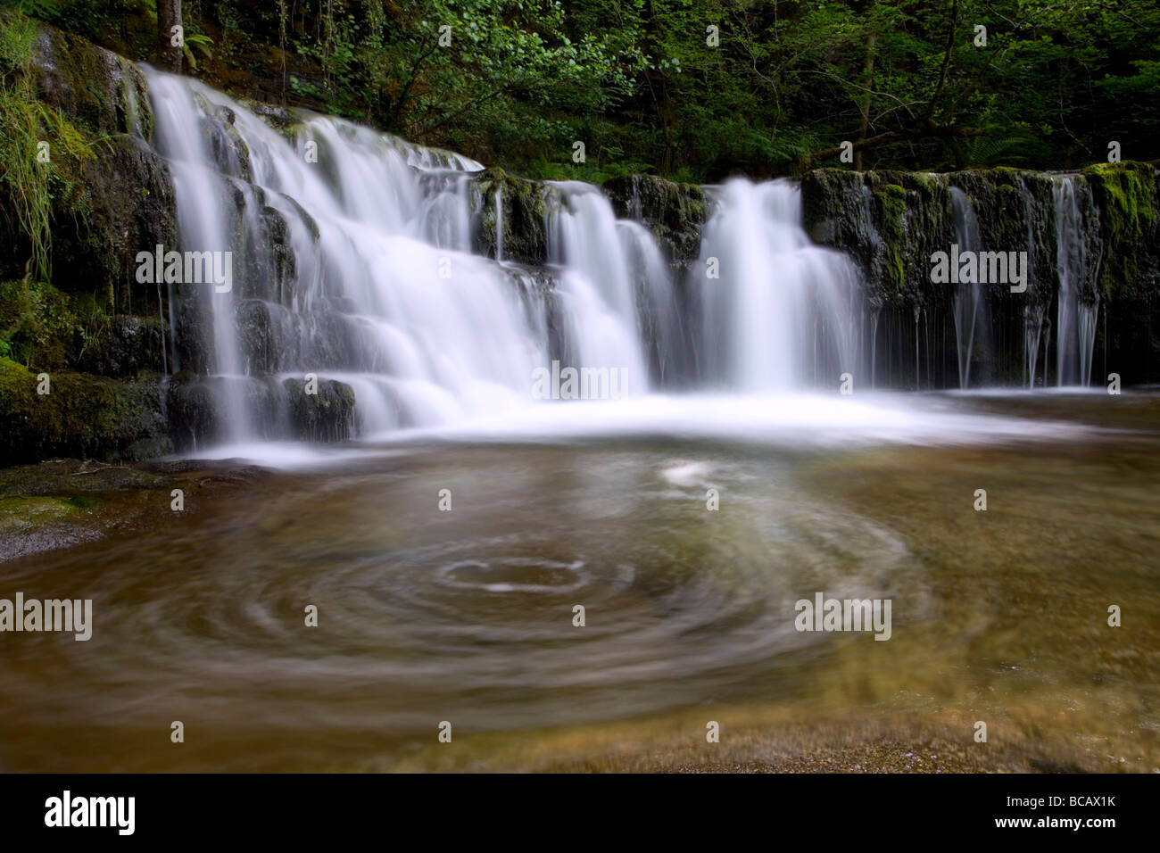 Swirls in front of Sgwd Ddwli Isaf waterfall near Pontneddfechan in the ...