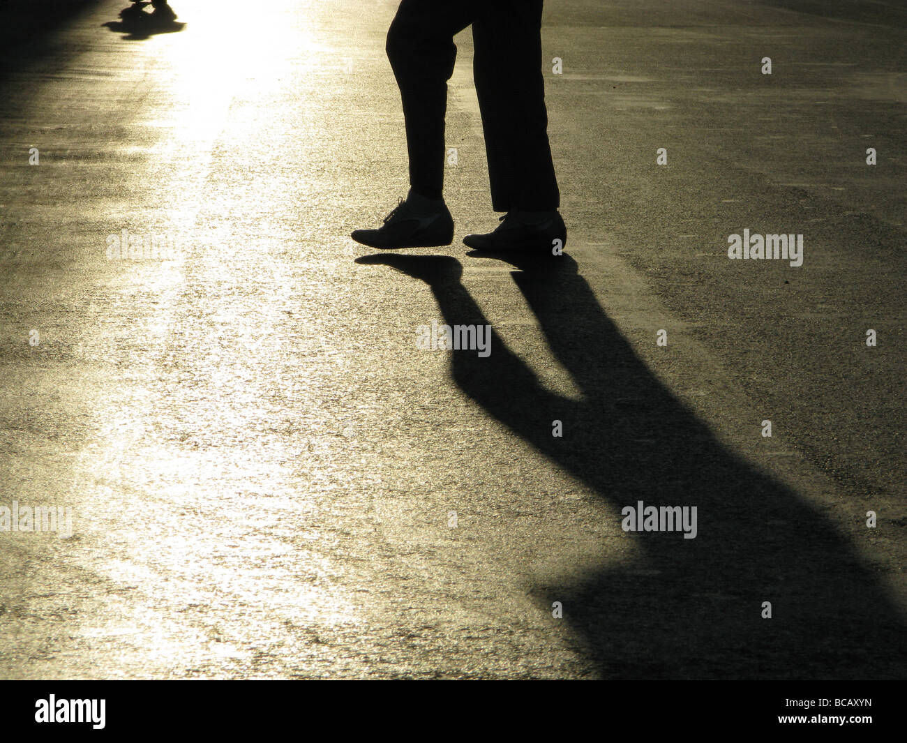 one person walking in empty street road in city town Stock Photo - Alamy