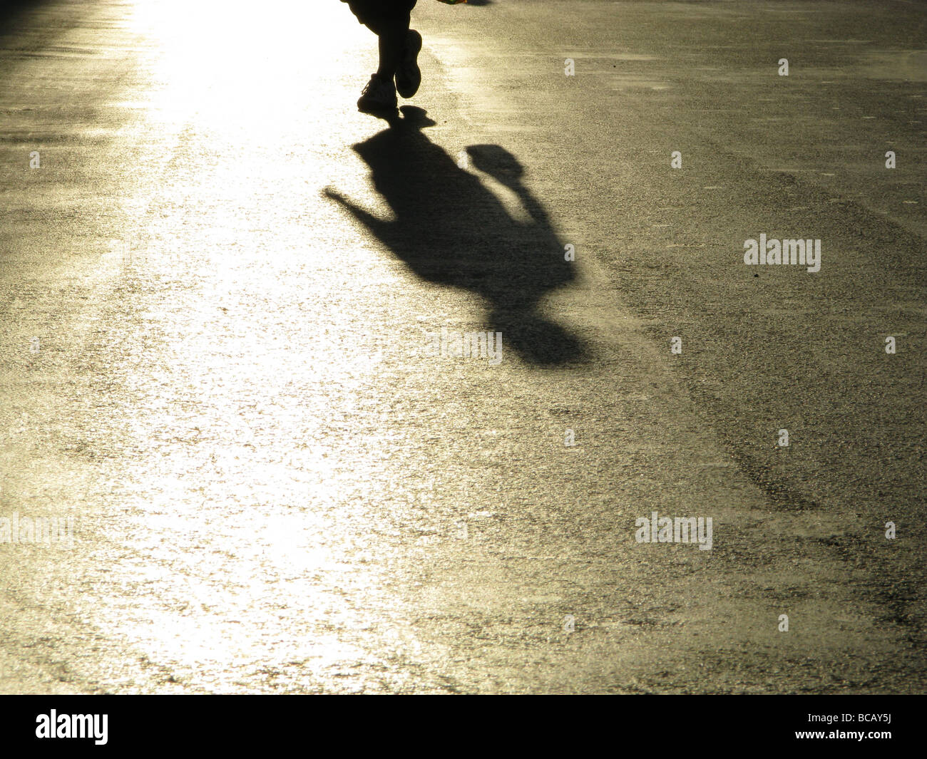 one person walking in empty street road in city town Stock Photo - Alamy