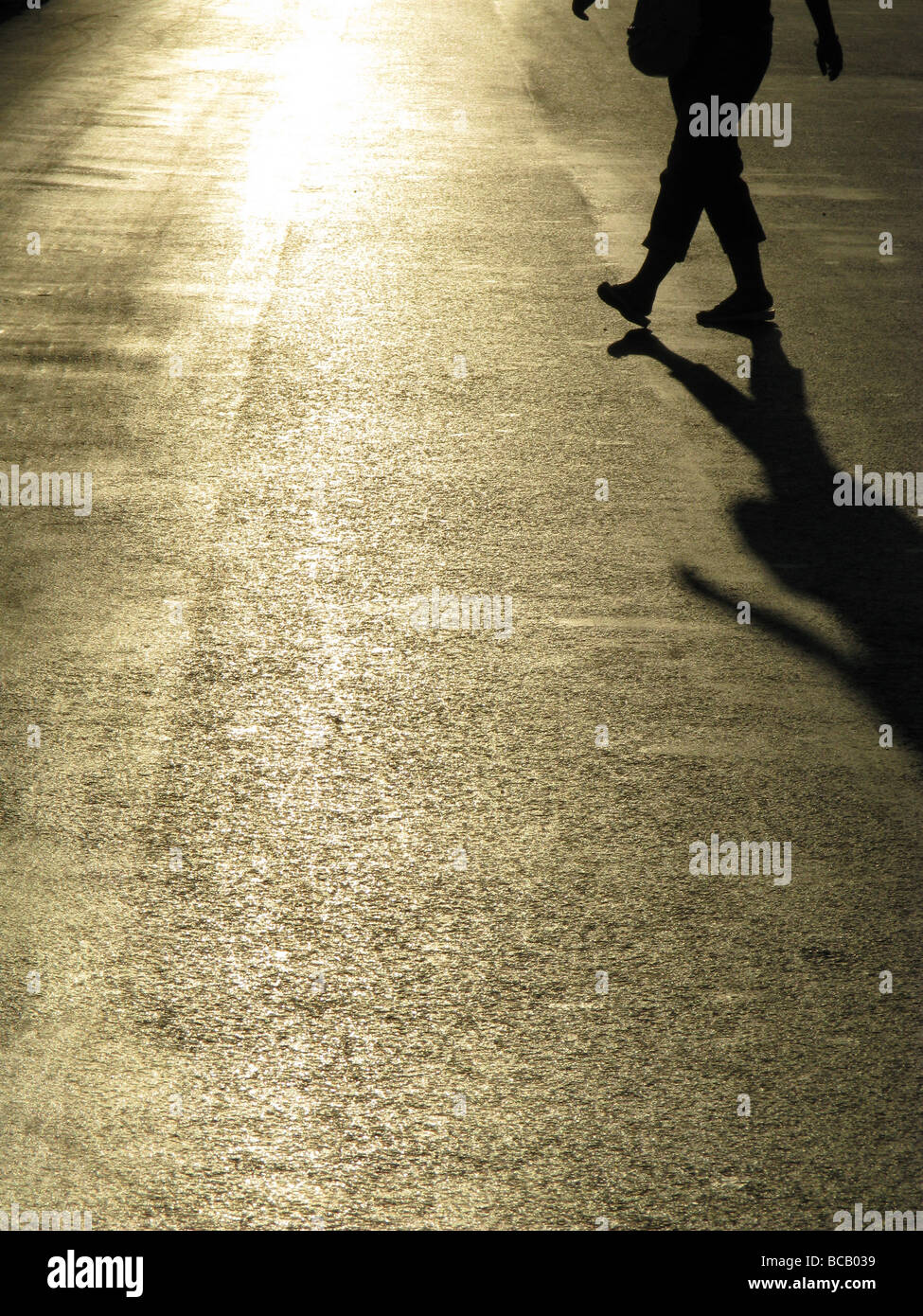 one person walking in empty street road in city town Stock Photo - Alamy