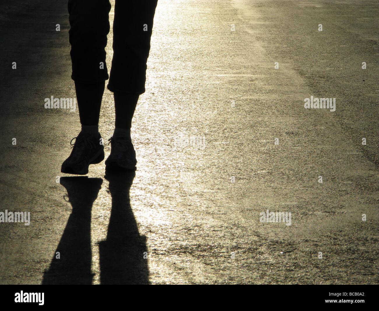 one person walking in empty street road in city town Stock Photo - Alamy
