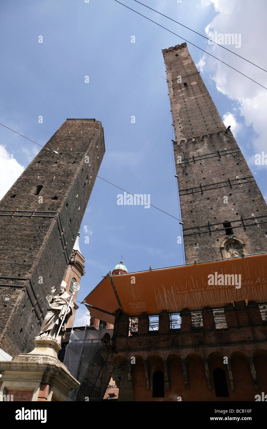 looking up at the two towers with the statue of st petronius by ...