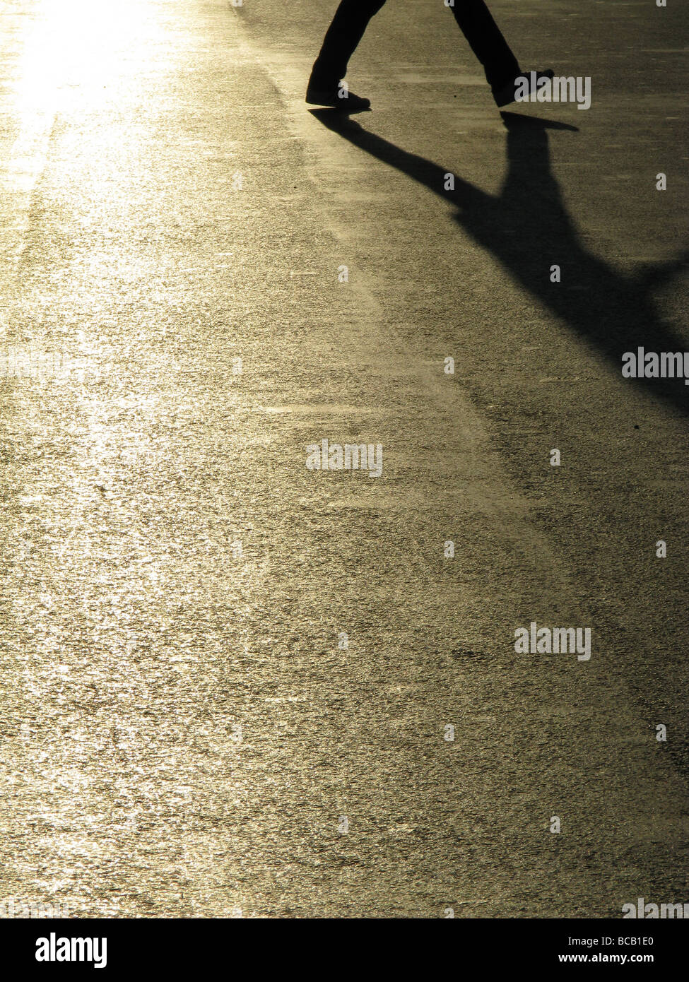 one person walking in empty street road in city town Stock Photo - Alamy