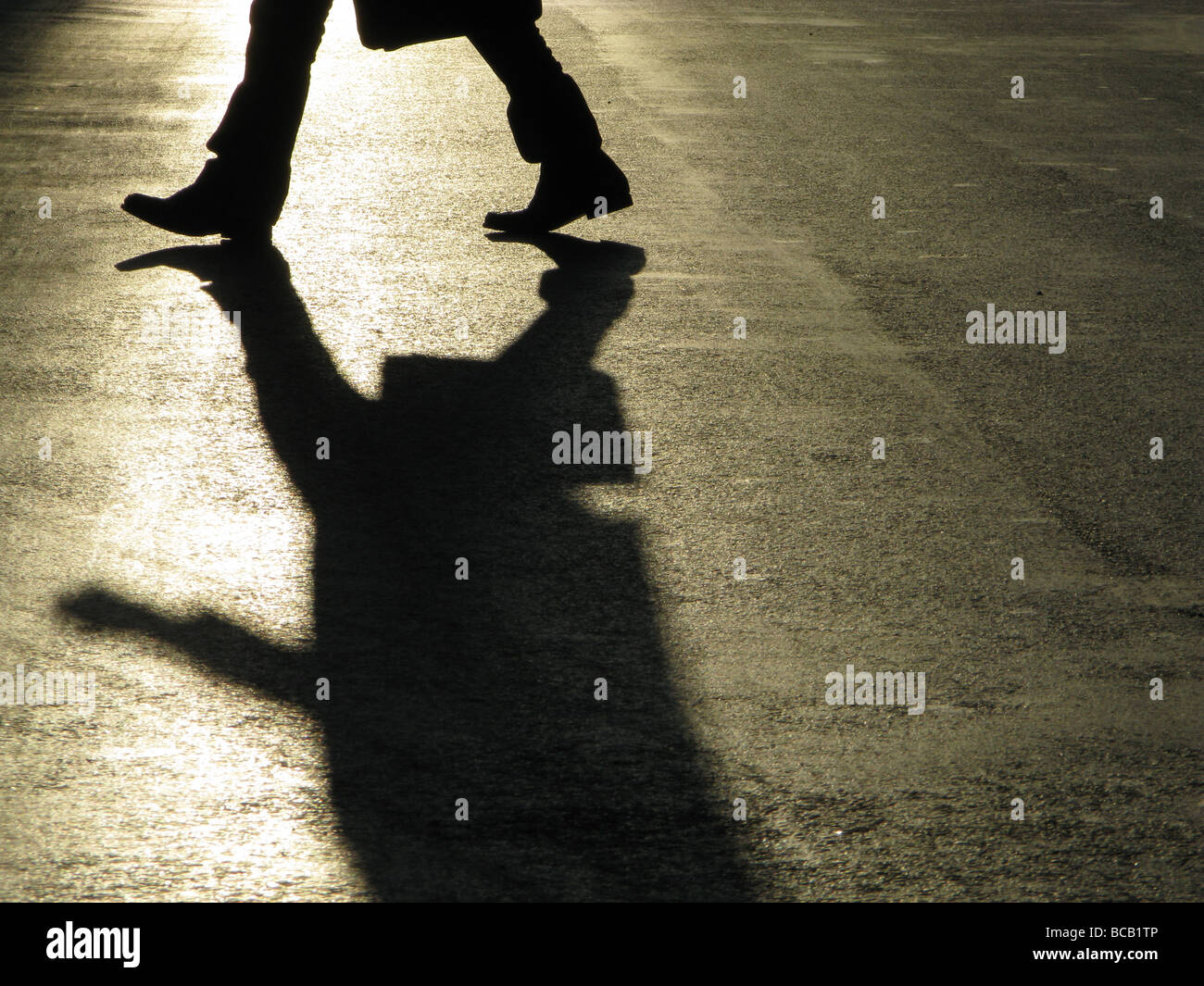 one person walking in empty street road in city town Stock Photo - Alamy