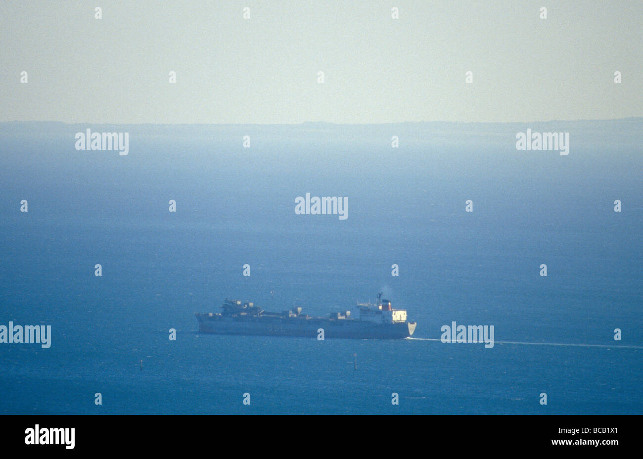 A cargo ship vessel heads out of port into Port Phillip Bay Stock Photo ...