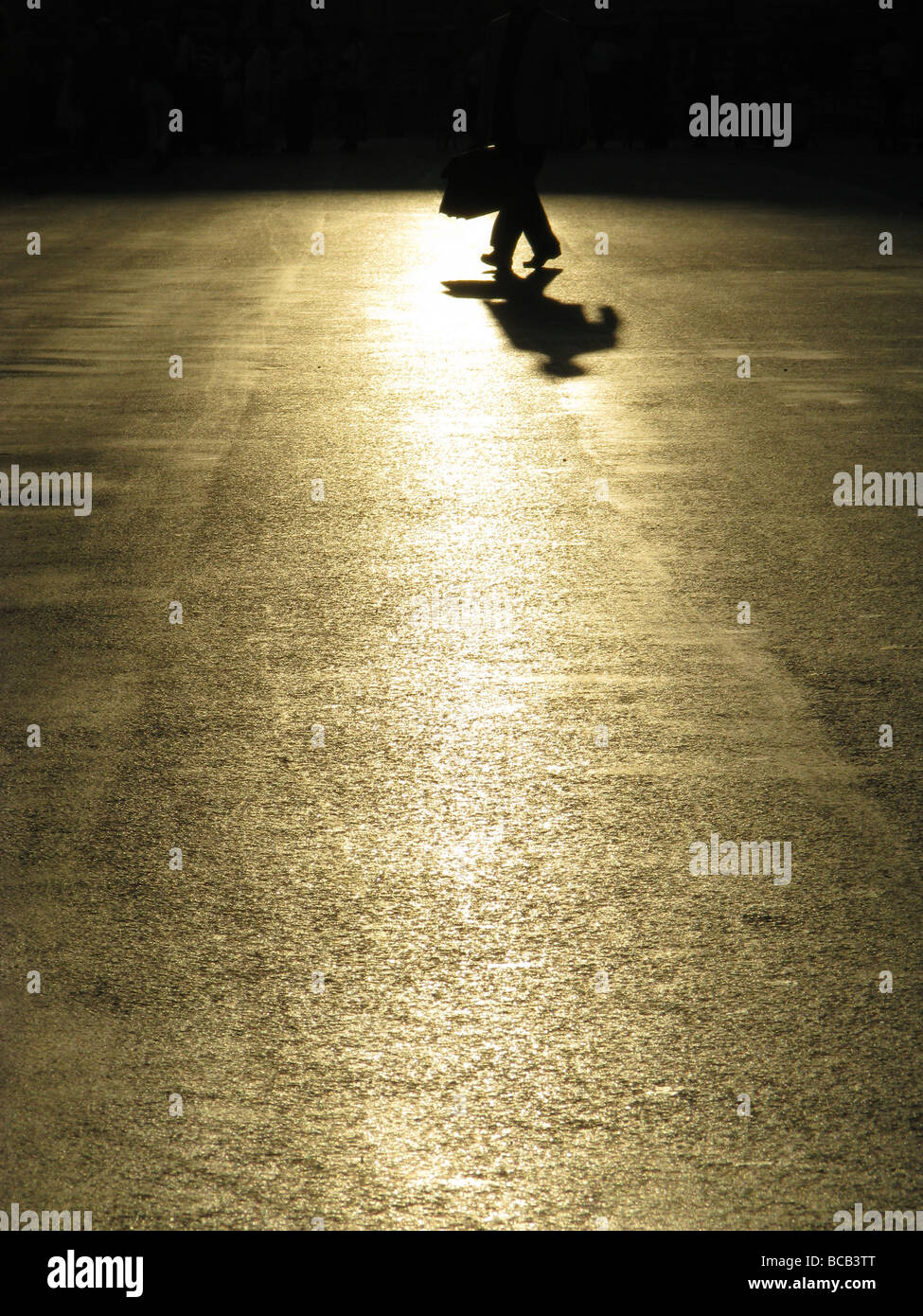 one person walking in empty street road in city town Stock Photo - Alamy