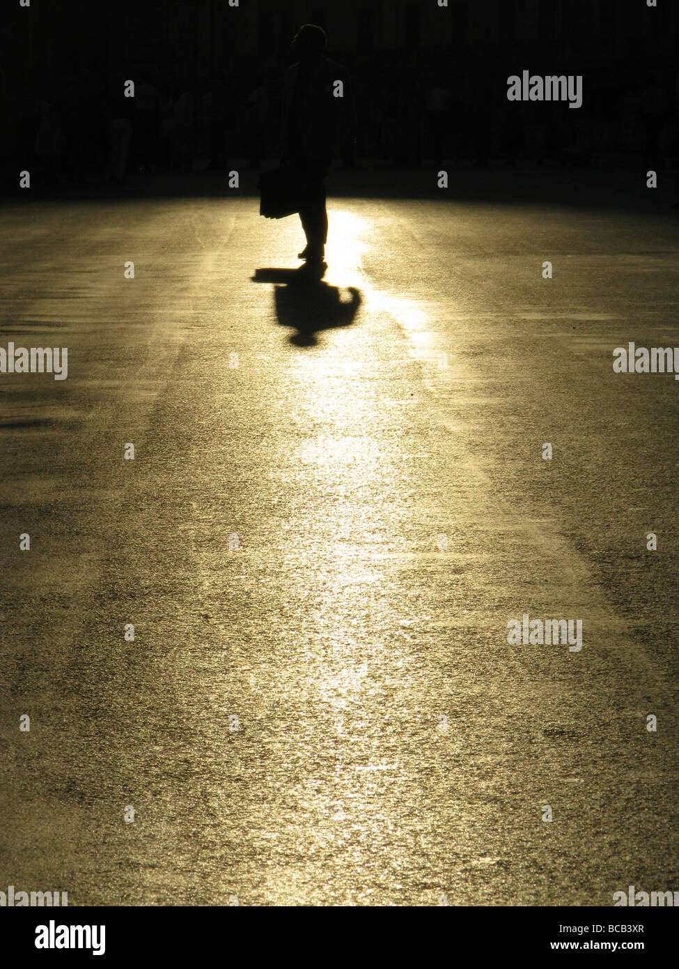 one person walking in empty street road in city town Stock Photo - Alamy