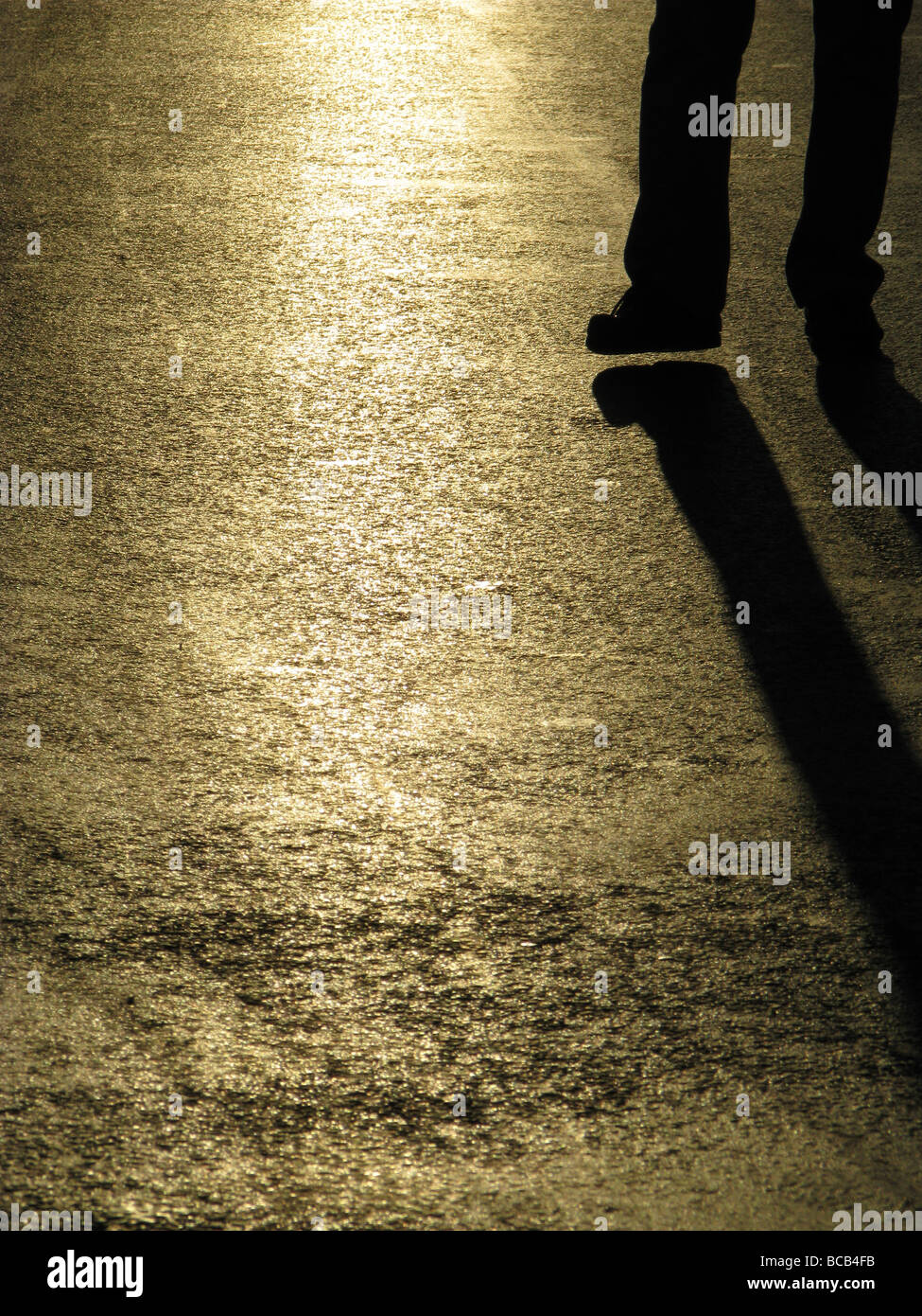 one person walking in empty street road in city town Stock Photo - Alamy