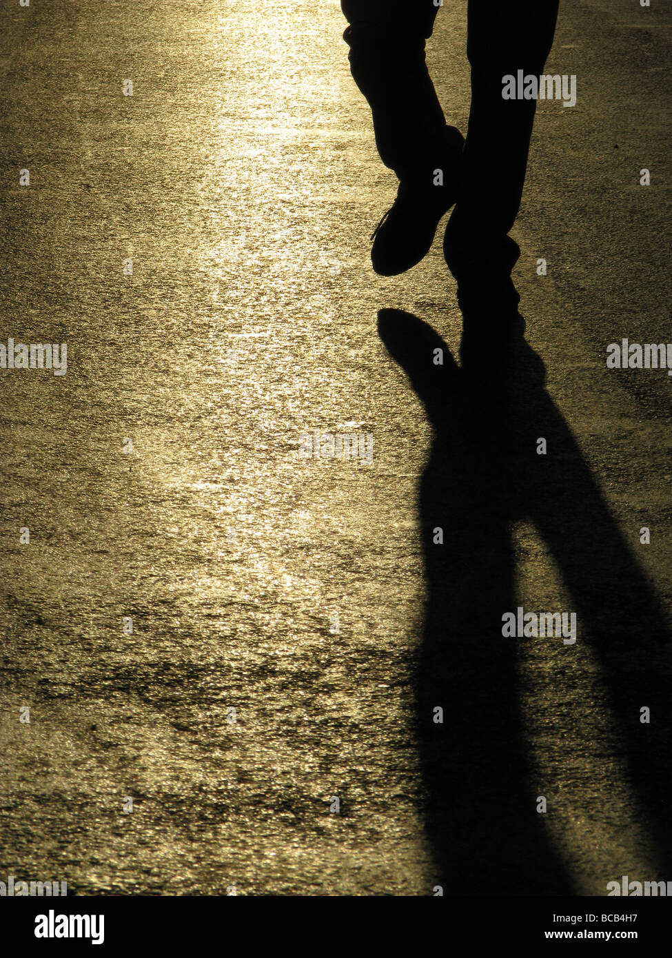one person walking in empty street road in city town Stock Photo - Alamy