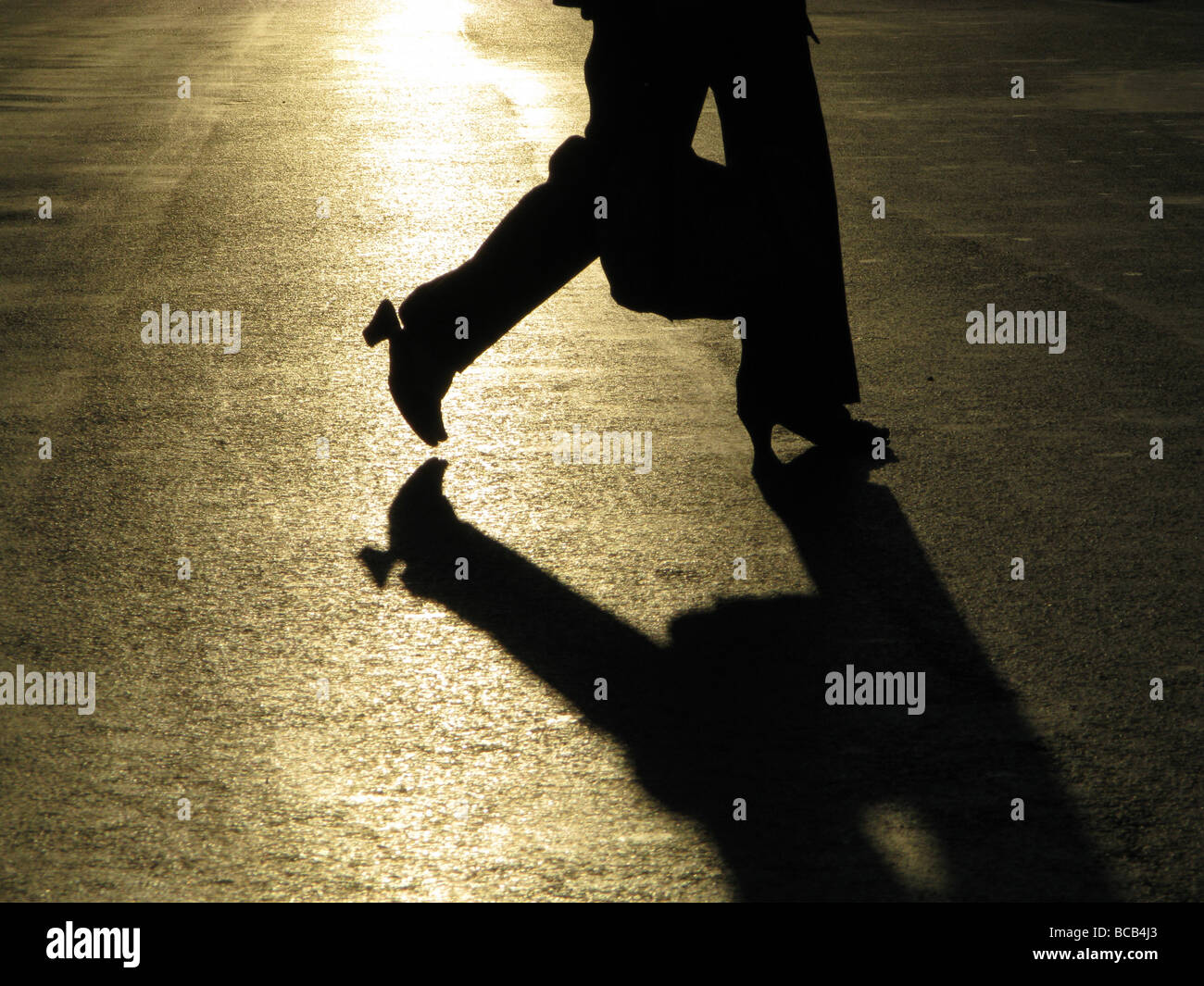 one person walking in empty street road in city town Stock Photo - Alamy
