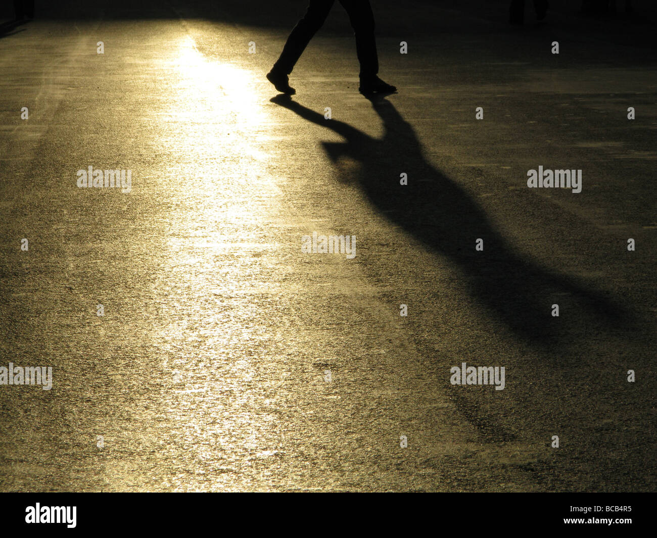 one person walking in empty street road in city town Stock Photo - Alamy