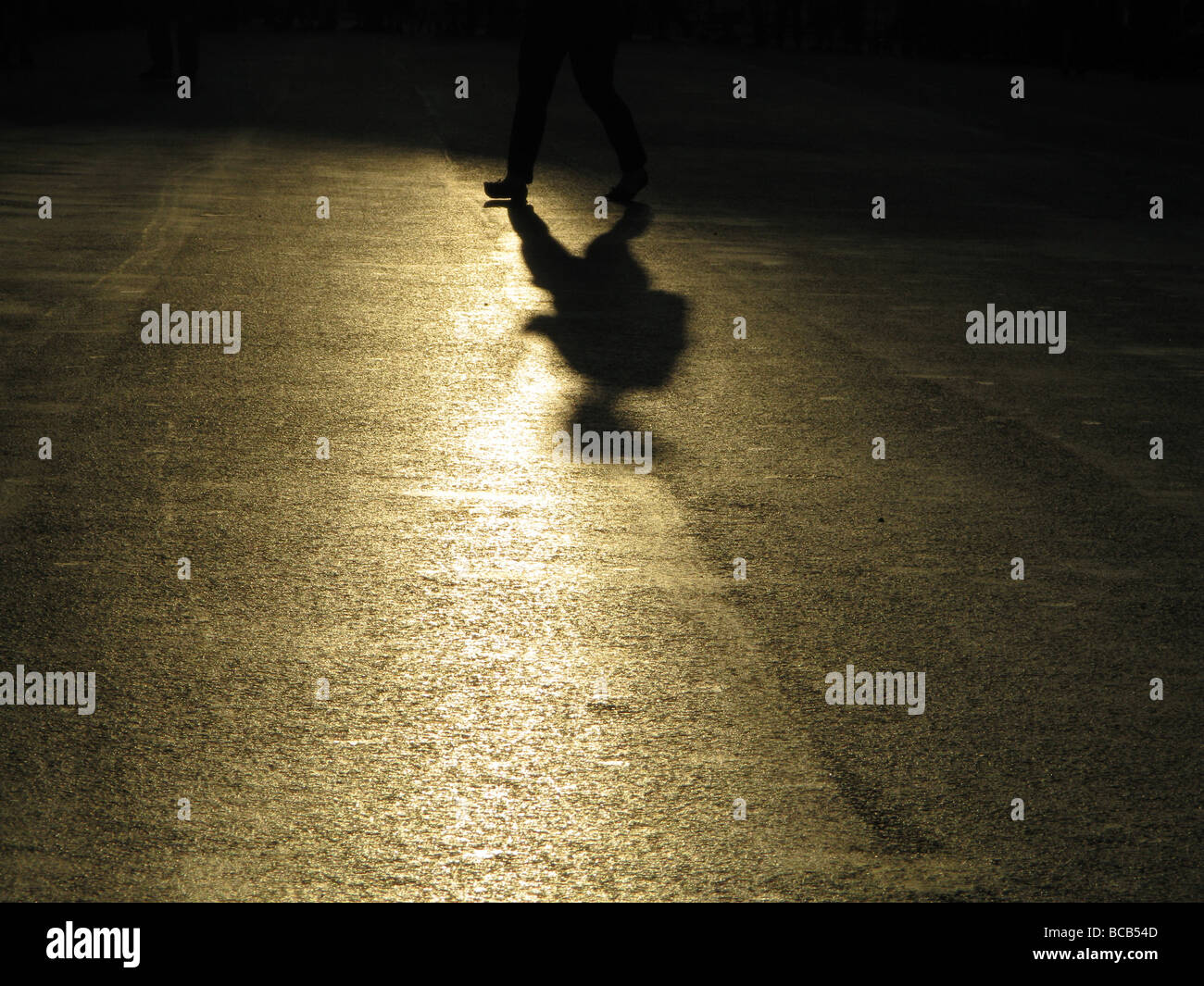 one person walking in empty street road in city town Stock Photo - Alamy
